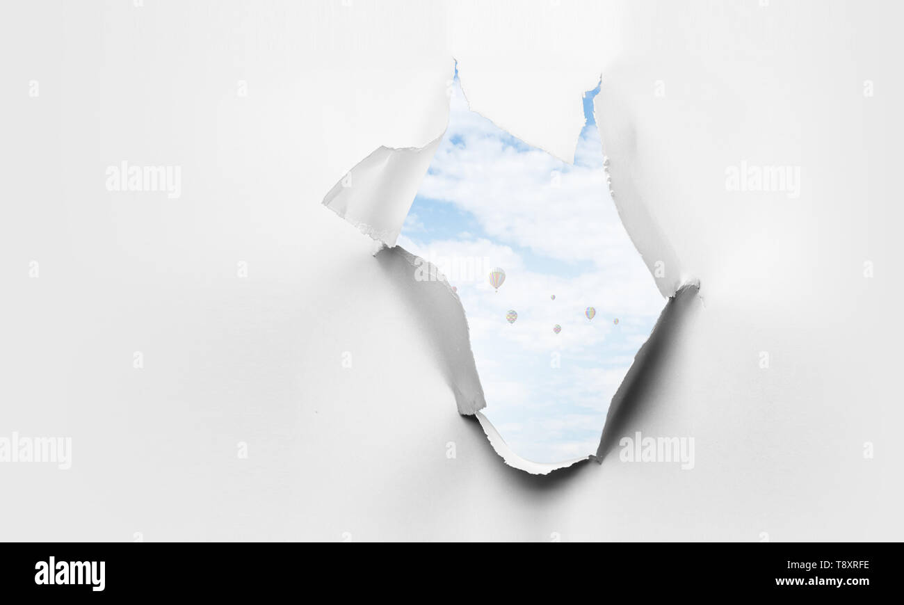 Effect of torn paper hole Stock Photo - Alamy