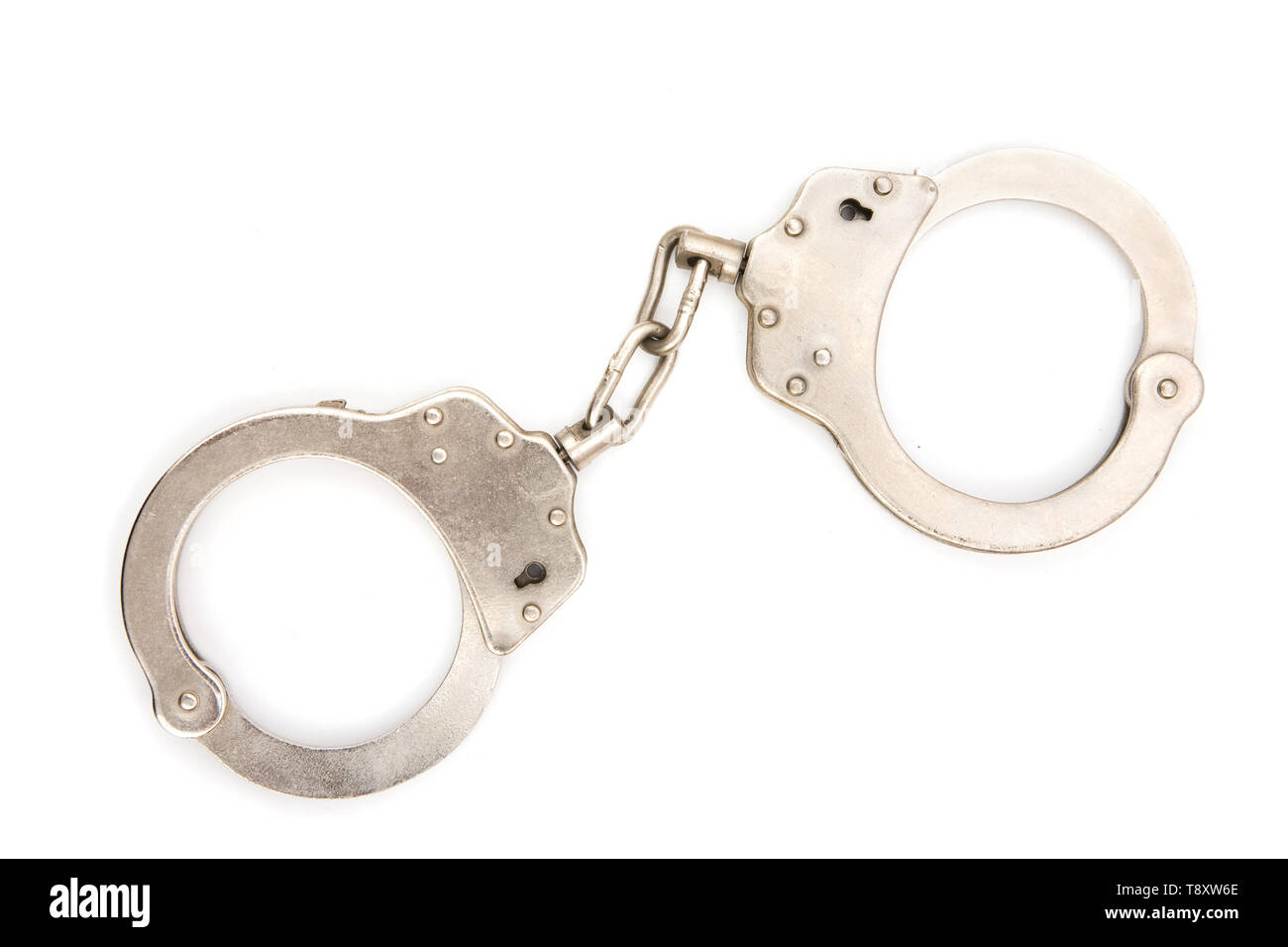 police handcuffs close up on white background Stock Photo - Alamy