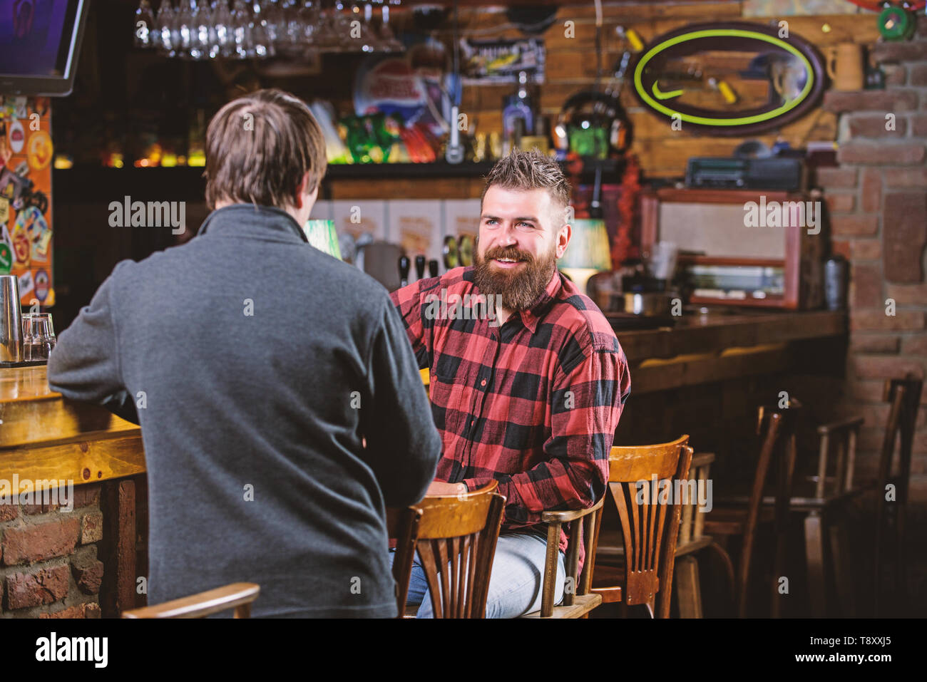 Weekend leisure. Friday relaxation in pub. Friends relaxing in pub ...