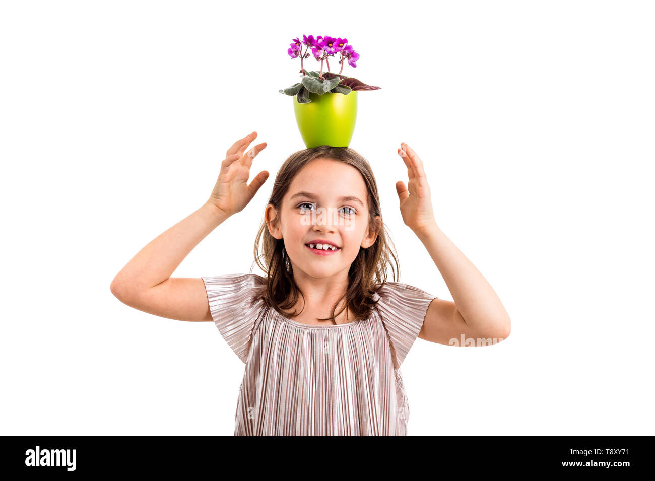 Girl holding potted plant hi-res stock photography and images - Alamy