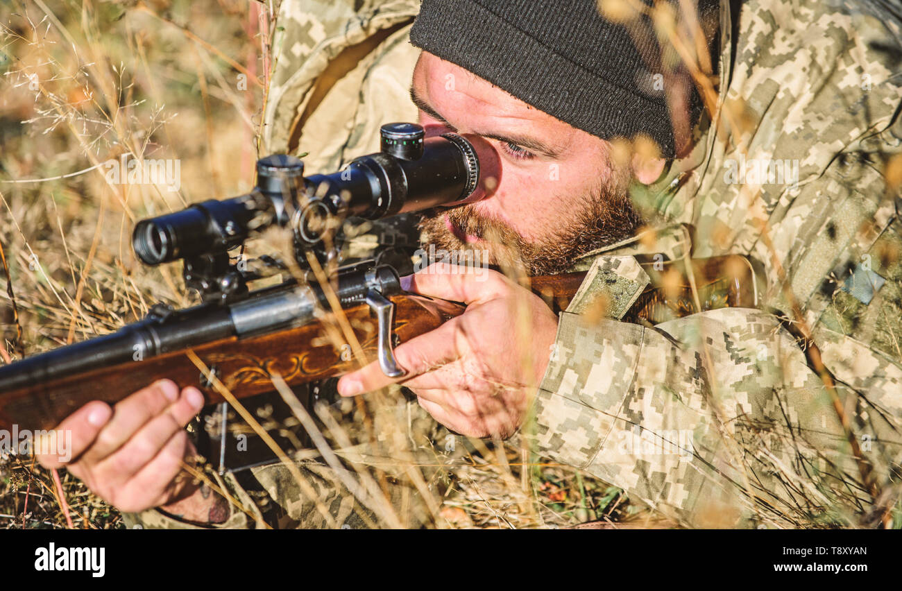 Army forces. Camouflage. Bearded man hunter. Hunting skills and weapon ...