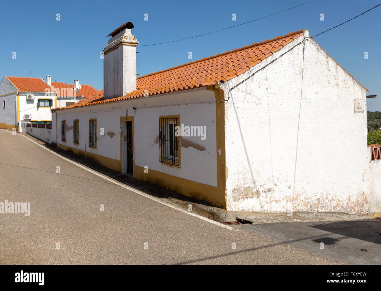 Traditional one storey houses with very large chimney pots in village ...