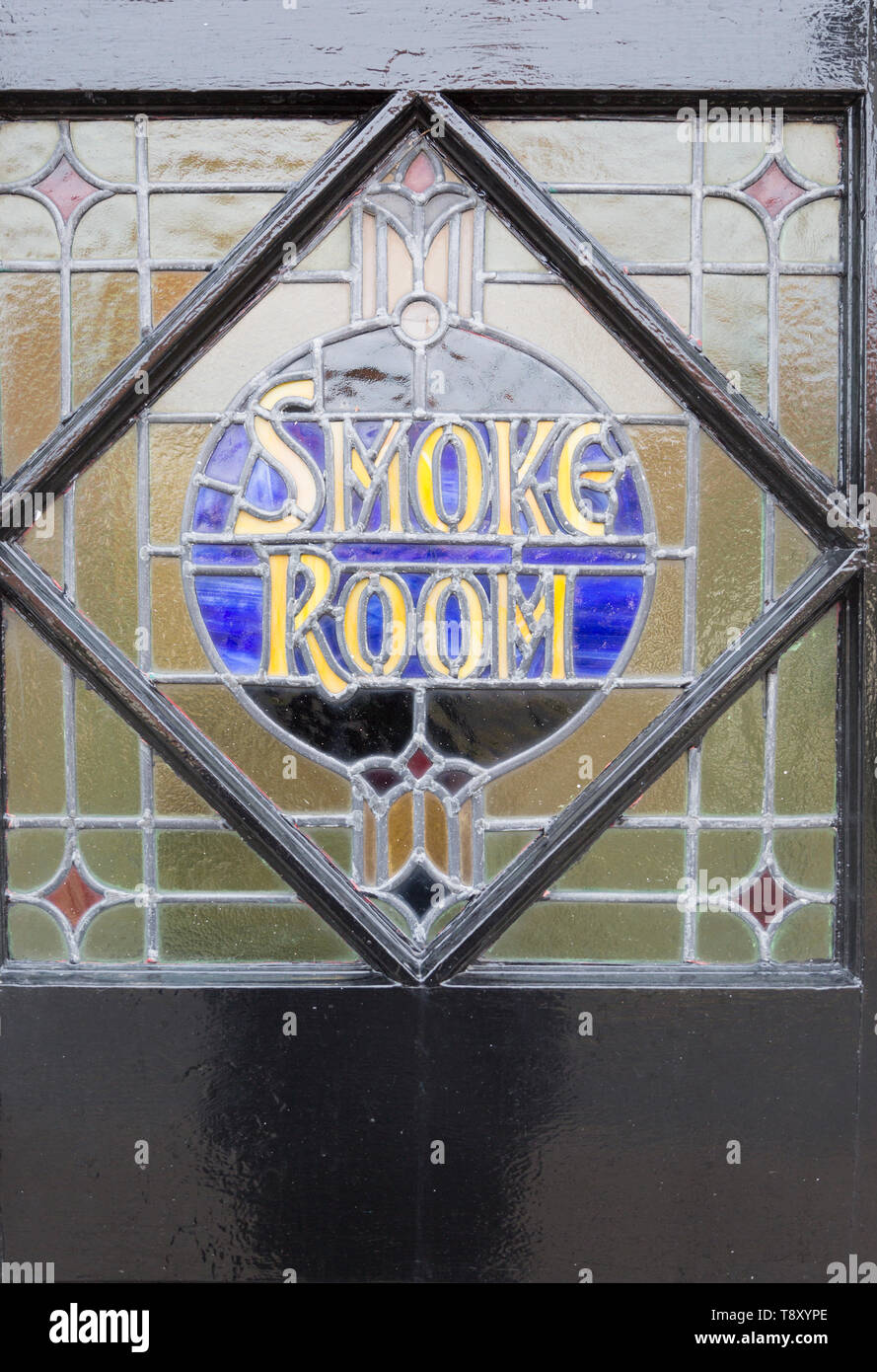 Close-up of stained glass window old vintage pub sign for Smoke Room ...