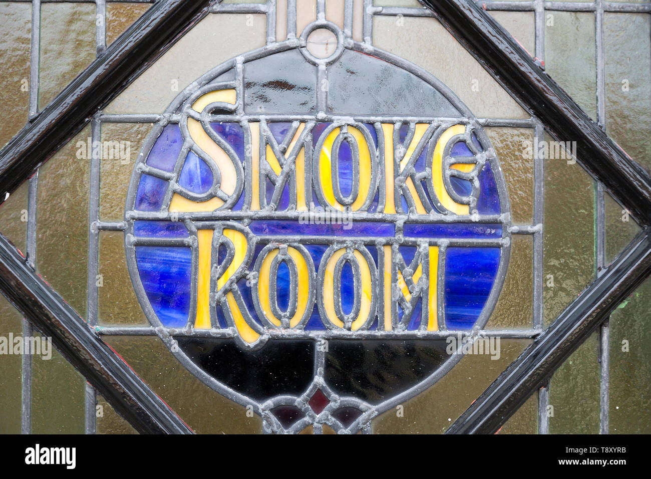 Close-up of stained glass window old vintage pub sign for Smoke Room ...