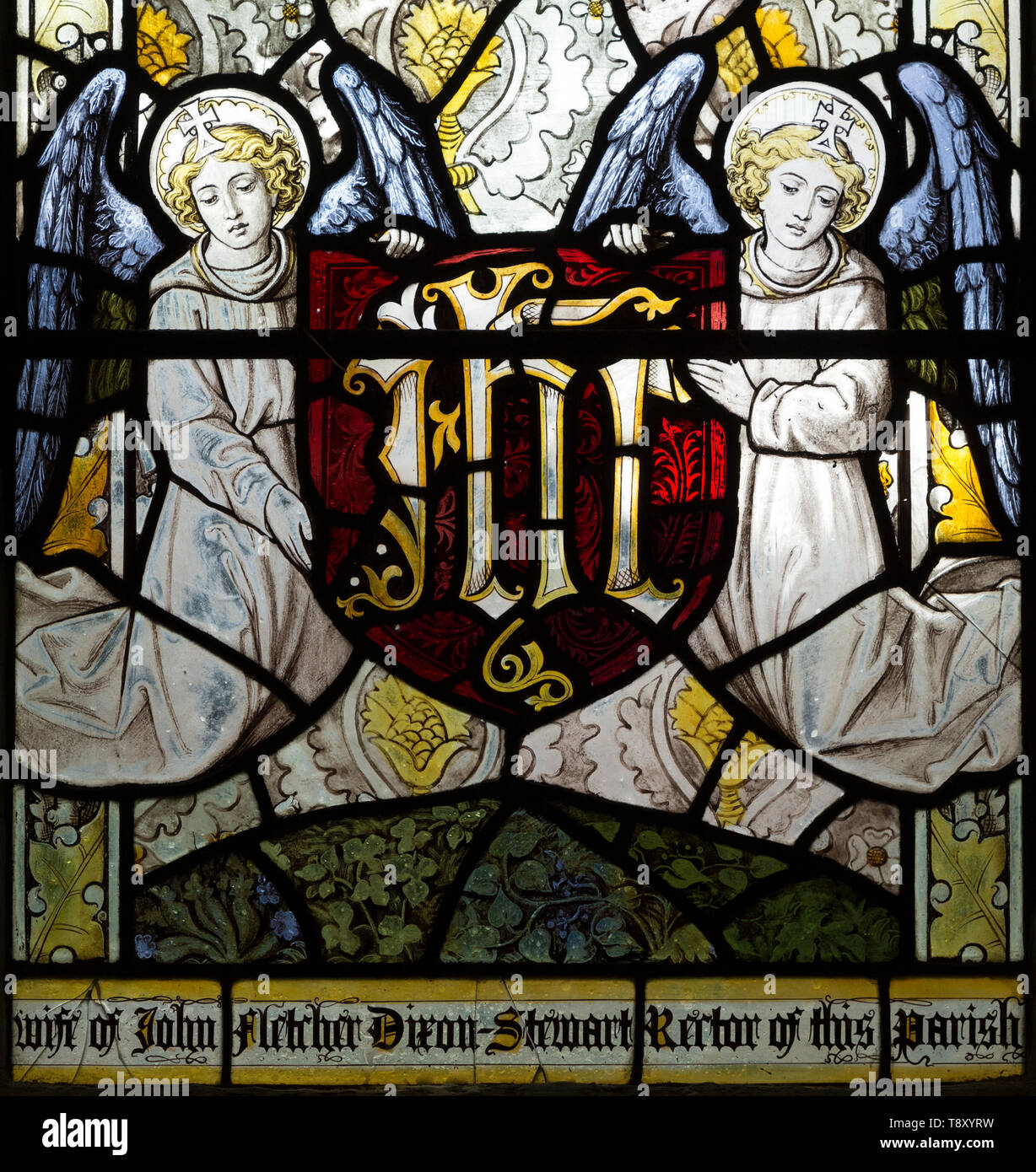 Angels holding shield with IHS motif stained glass window by Burlisson ...