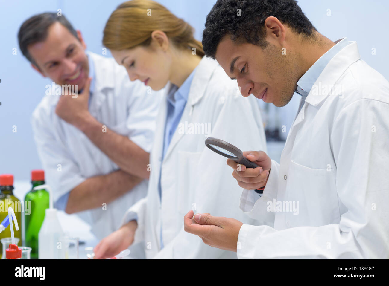 engineer with magnifier glass Stock Photo - Alamy