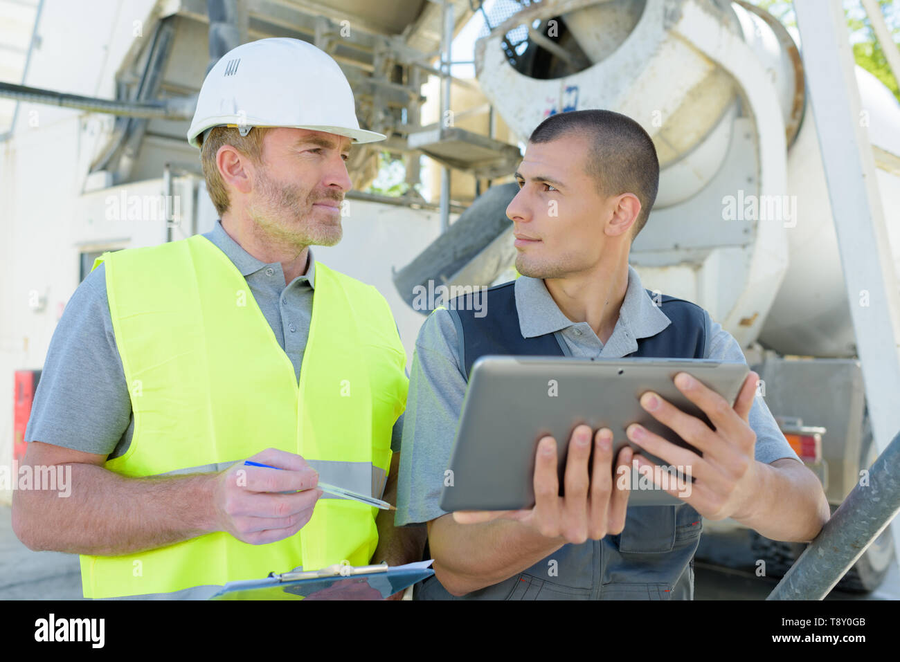 Two engineers looking at computer hi-res stock photography and images ...