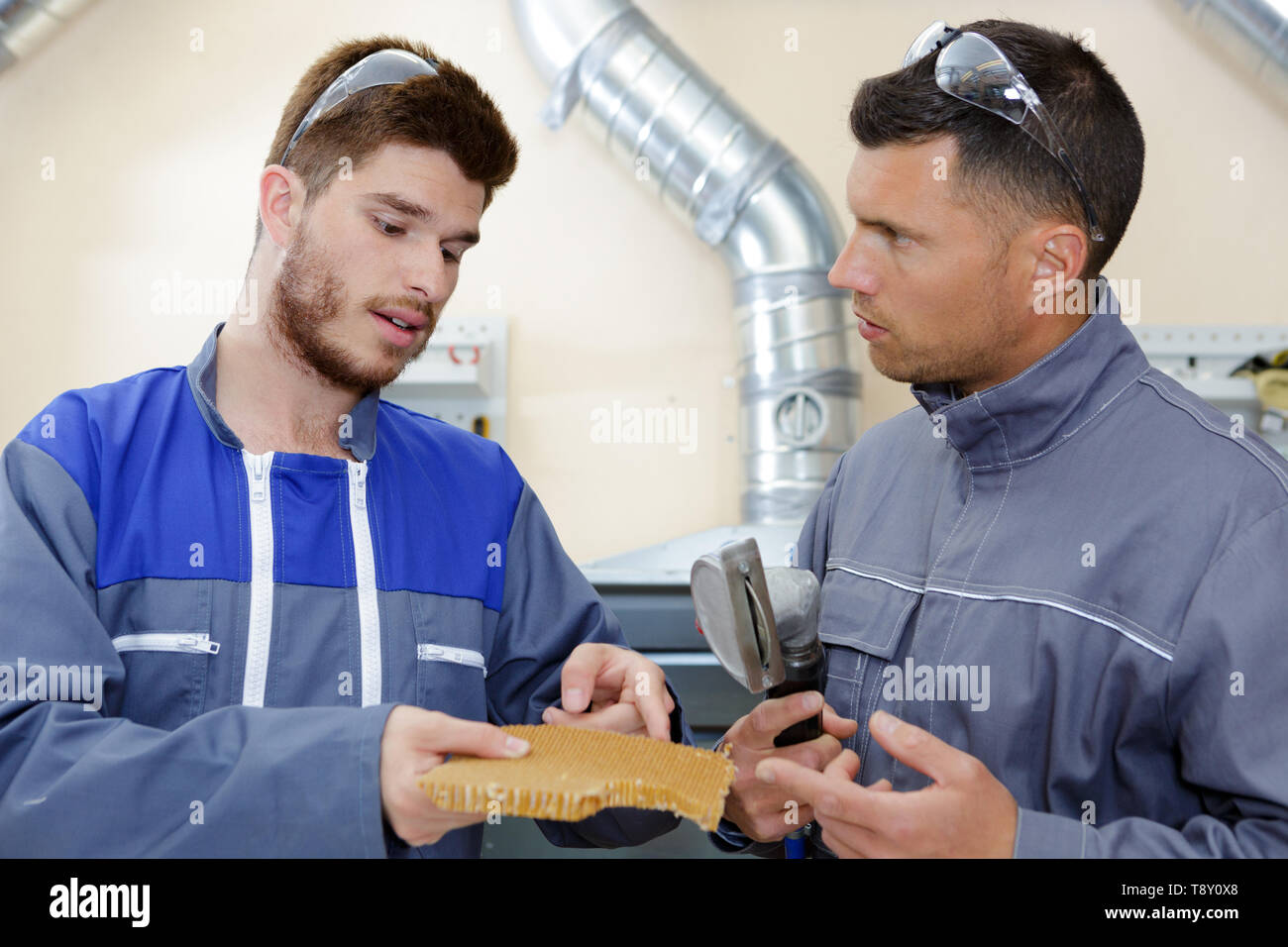 Two factory workers pointing hi-res stock photography and images - Alamy