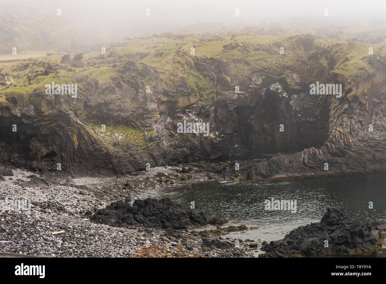 Thick fog conditions at Badstofa Rock Foamation in Hellnar, Iceland ...