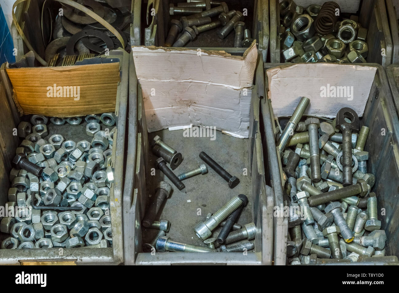 Metal screws and steel bolts in a storage room of a factory Stock Photo ...