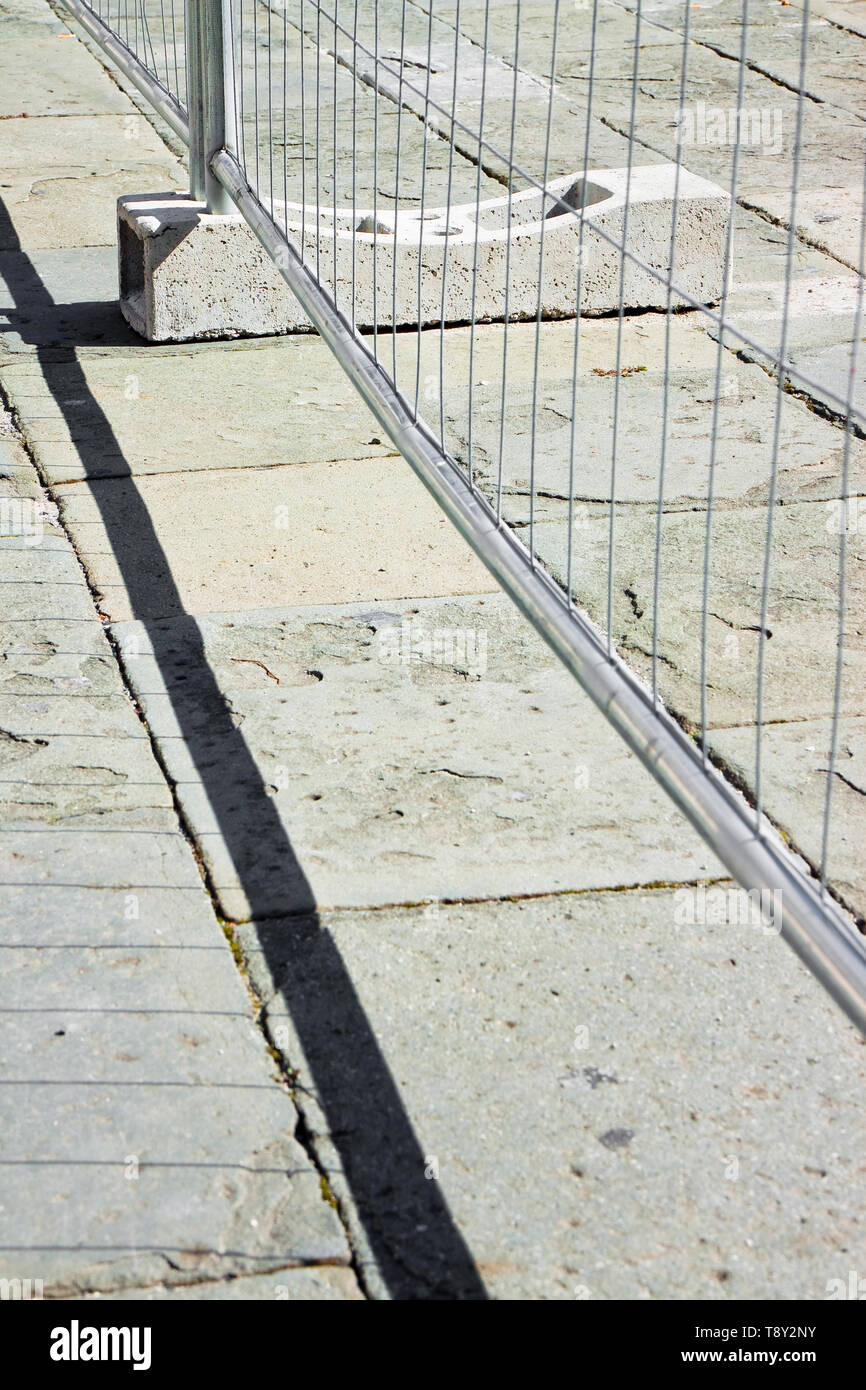 Metal barrier in a stone road - concept image Stock Photo - Alamy