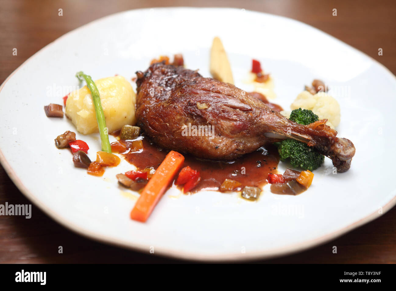 Duck confit , Roasted duck with blueberry sauce Stock Photo - Alamy