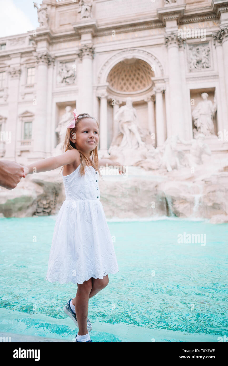 Adorable little girl background Trevi Fountain, Rome, Italy. Happy ...