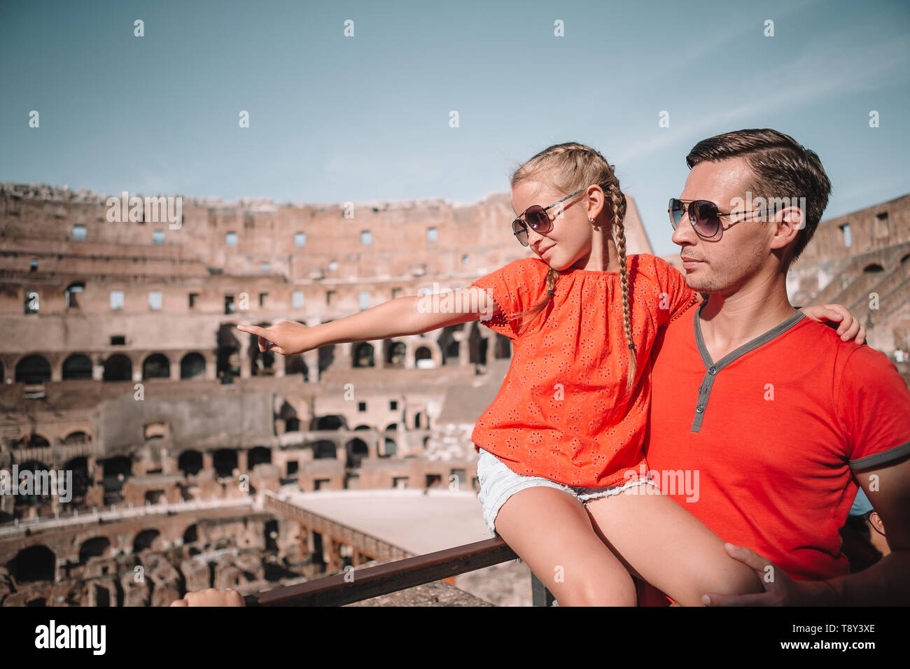 Happy family in Rome over Coliseum background Stock Photo - Alamy