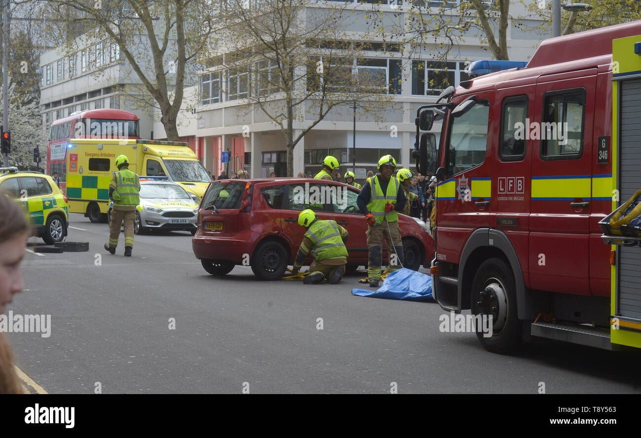A car flips in an road traffic accident on Kings Road in Chelsea ...