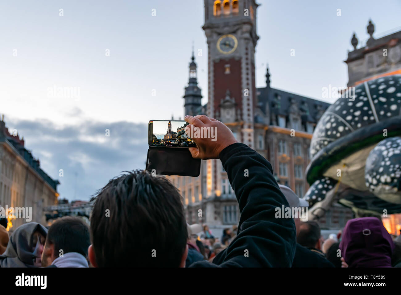Lille,FRANCE-May 04,2019: Man who makes videos and photos with a mobile ...
