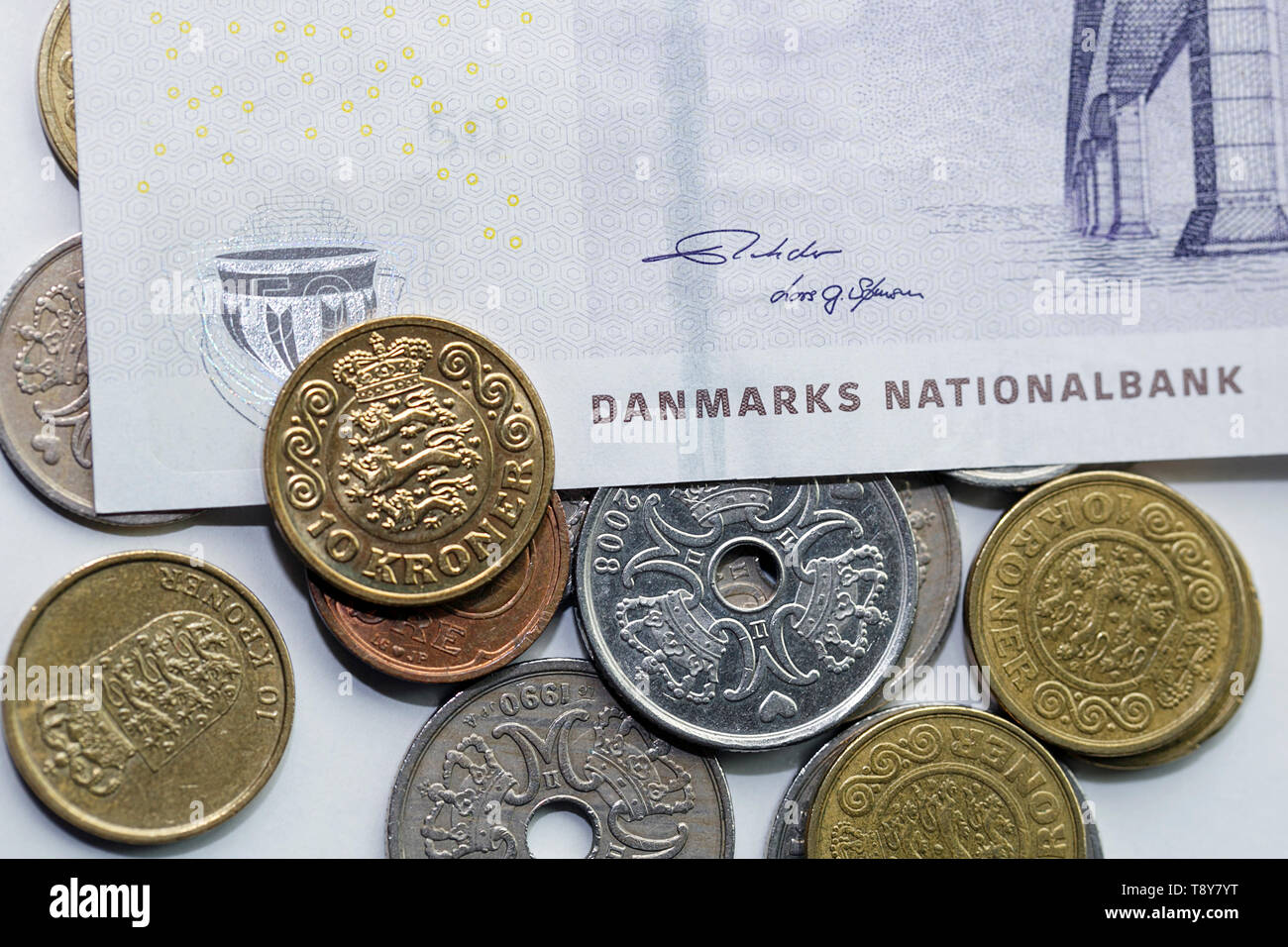 Danish coin over a fifty krone noteThe krone is the official currency ...