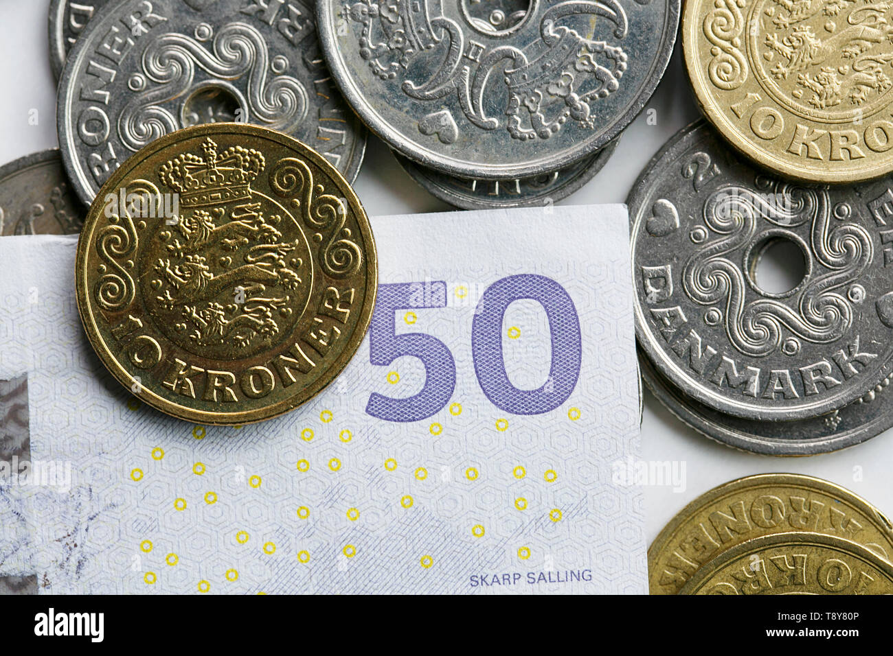 Danish coin over a fifty krone noteThe krone is the official currency ...