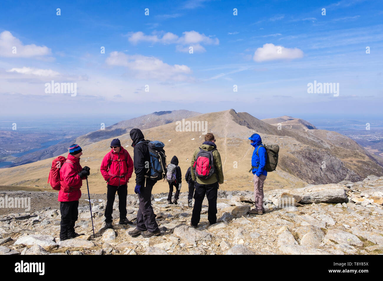Hikers hiking down Glyder Fawr to Y Garn mountain in mountains of ...