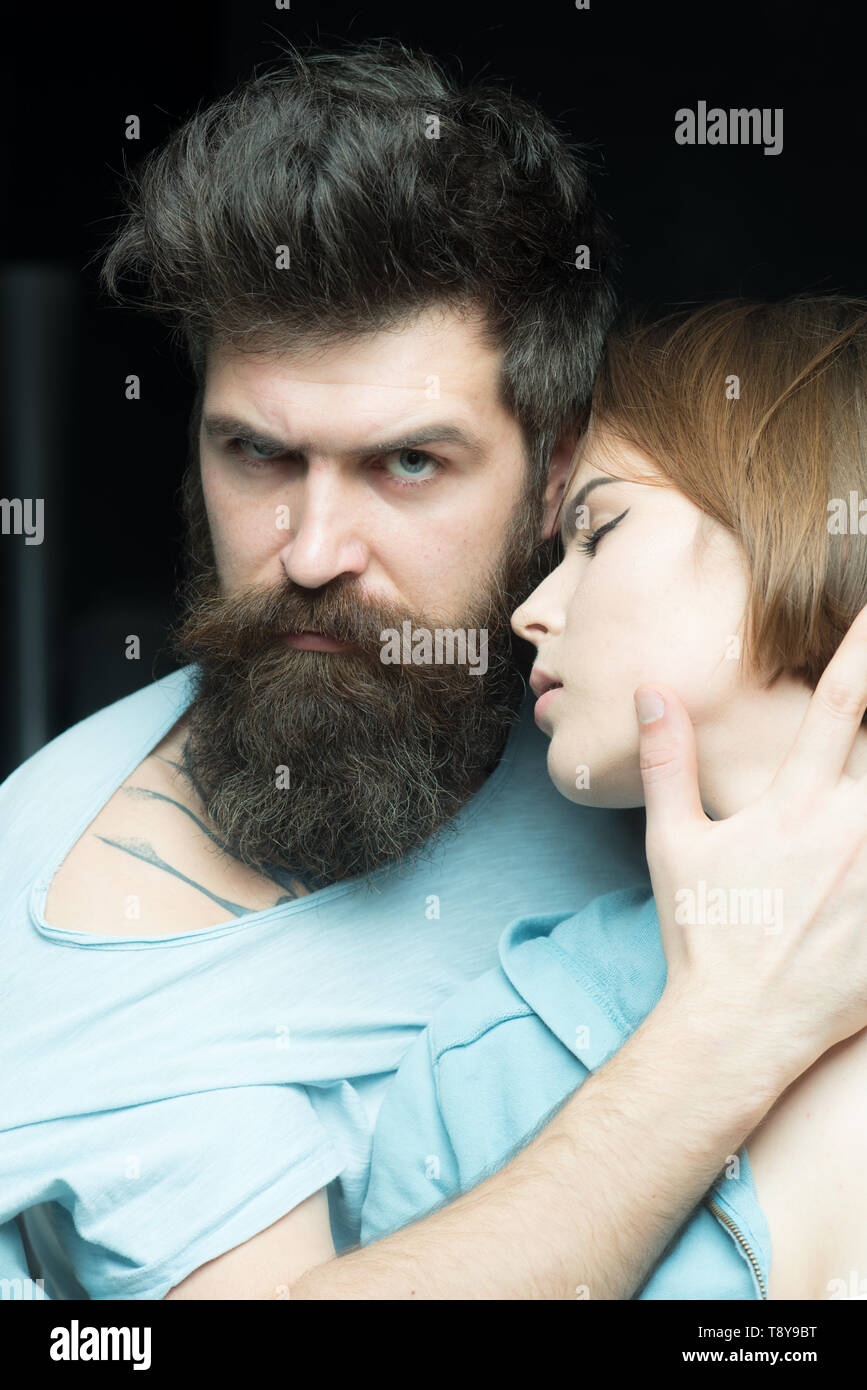 Fashion shot of couple after haircut. Barbershop concept. Man with ...