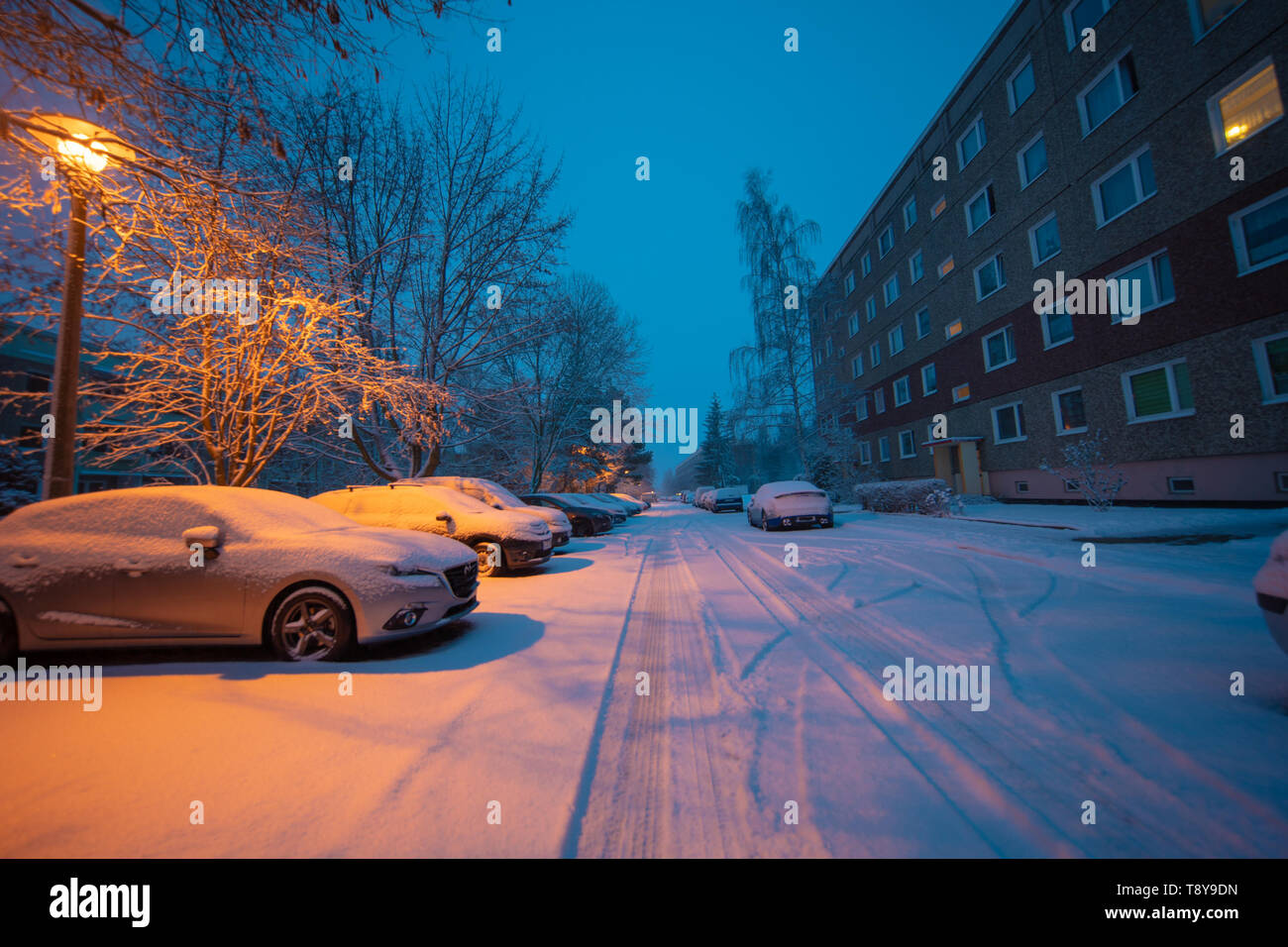 Snow in the night city Stock Photo - Alamy