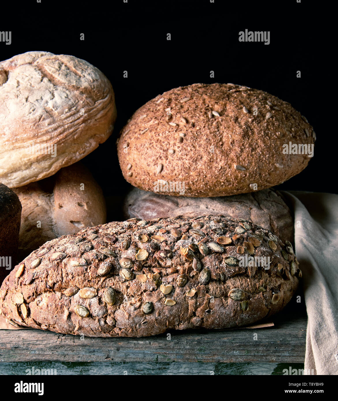 baked various breads , black background, close up Stock Photo - Alamy
