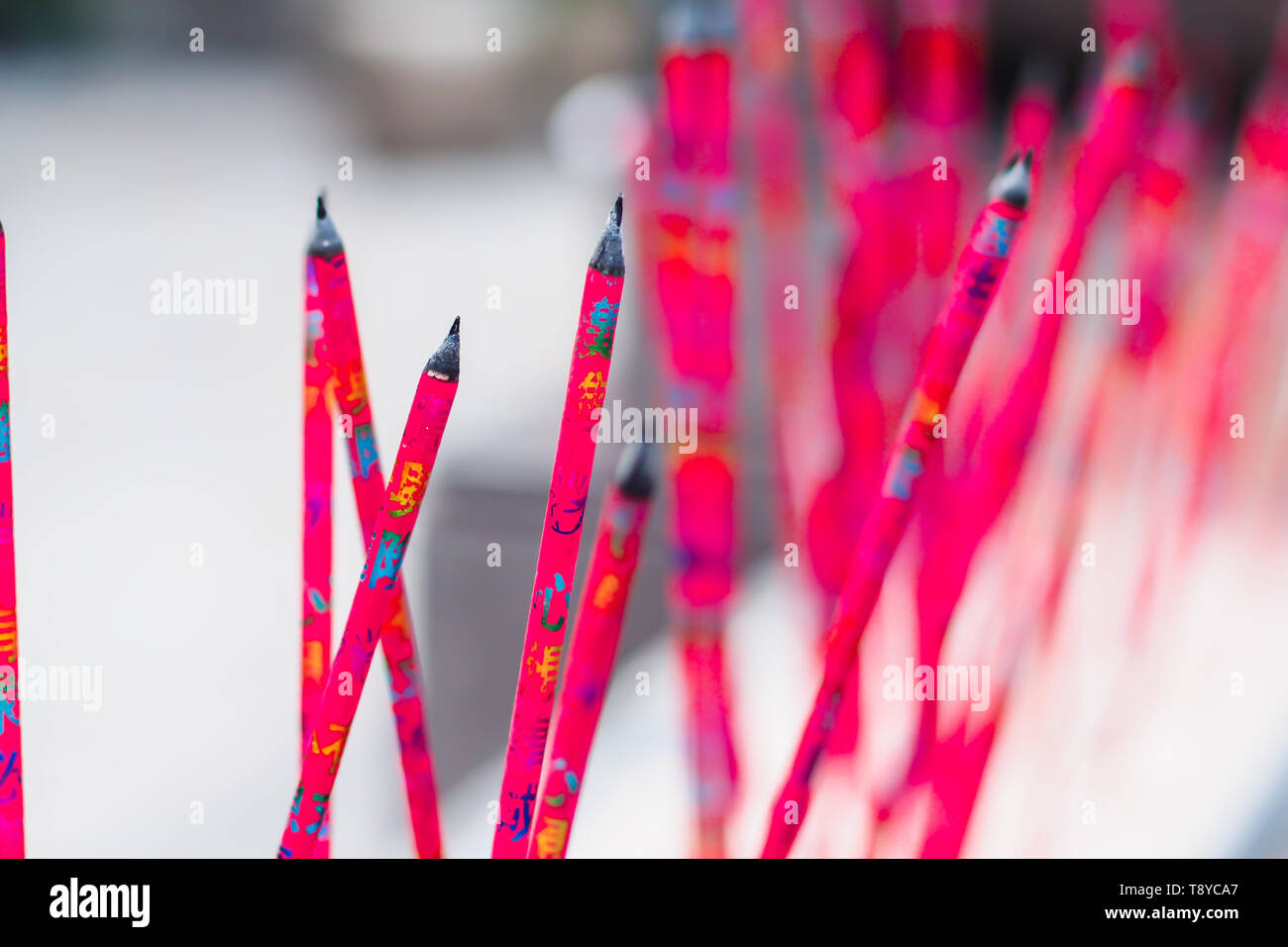 Burning red incense sticks in Chinese temple with letter write in the ...
