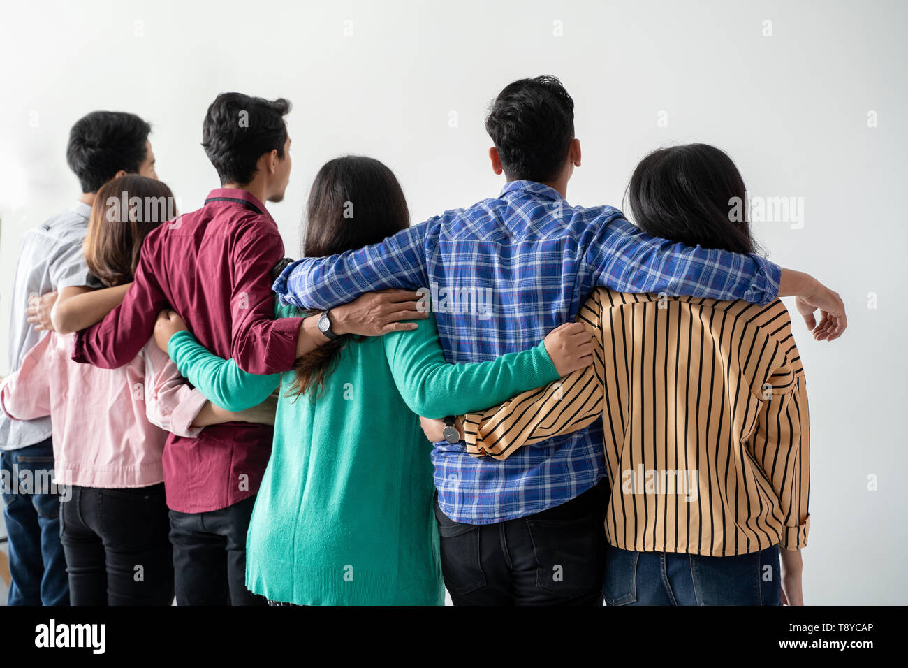 back view of friend holding hands and hug each other Stock Photo - Alamy