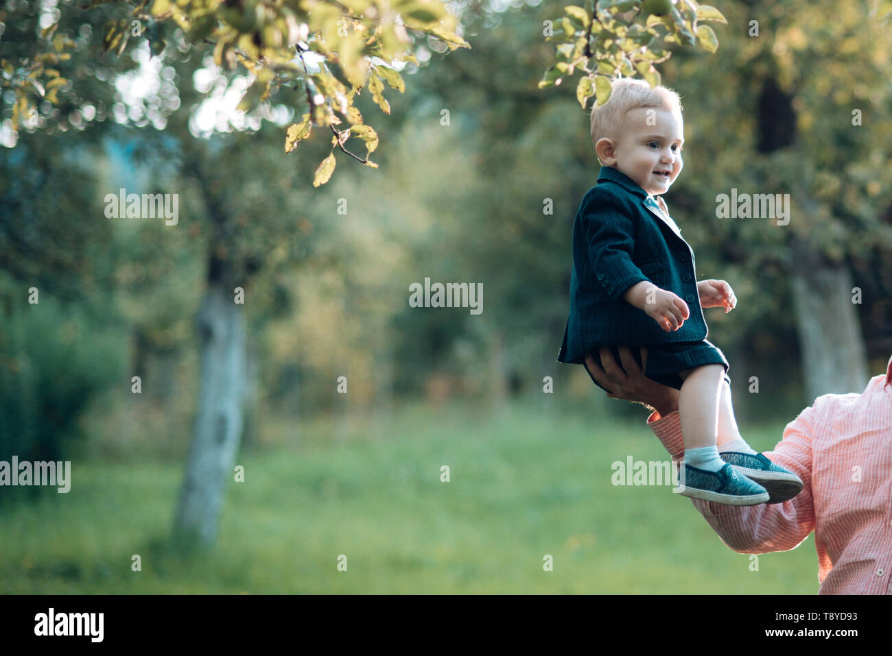 Boy under apple tree hi-res stock photography and images - Alamy