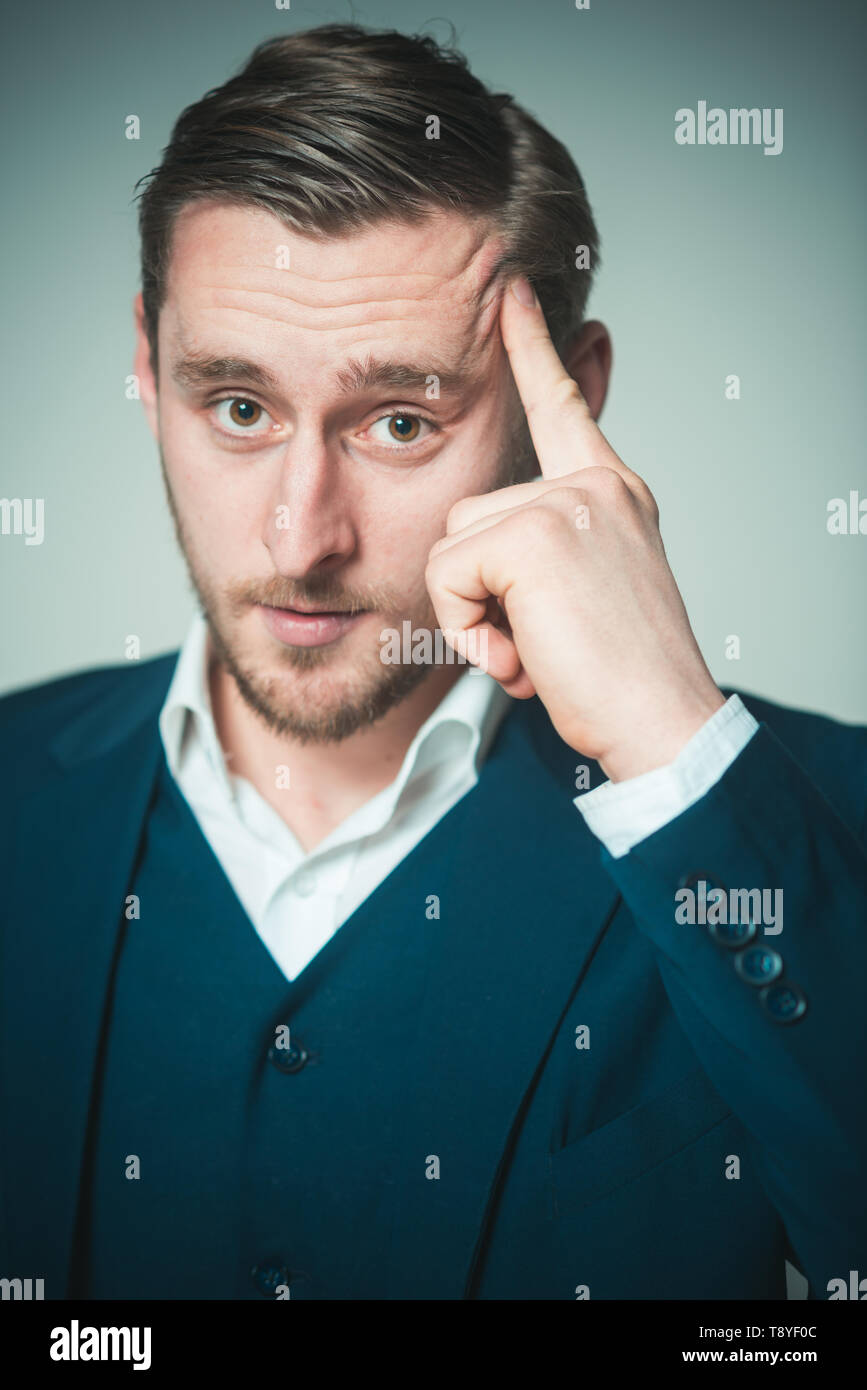 Thoughtful person. Man calm serious looking concentrated while touching ... Thoughtful person. Man calm serious looking concentrated while touching ...