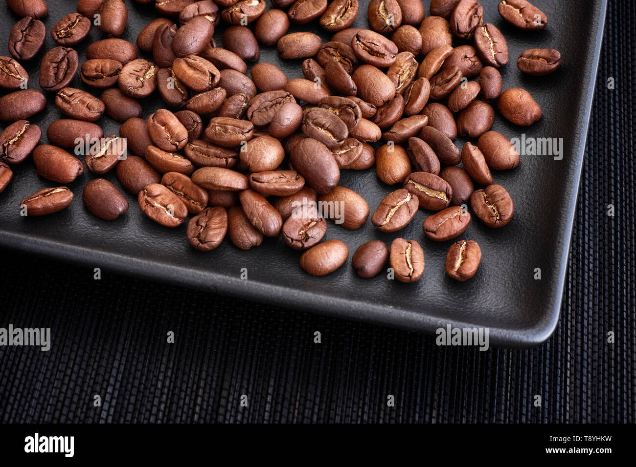 Roasted coffee beans. Low key. Close up Stock Photo - Alamy