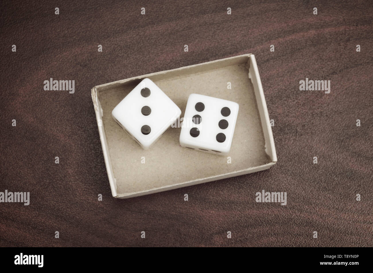 two dice in cardboard box Stock Photo - Alamy