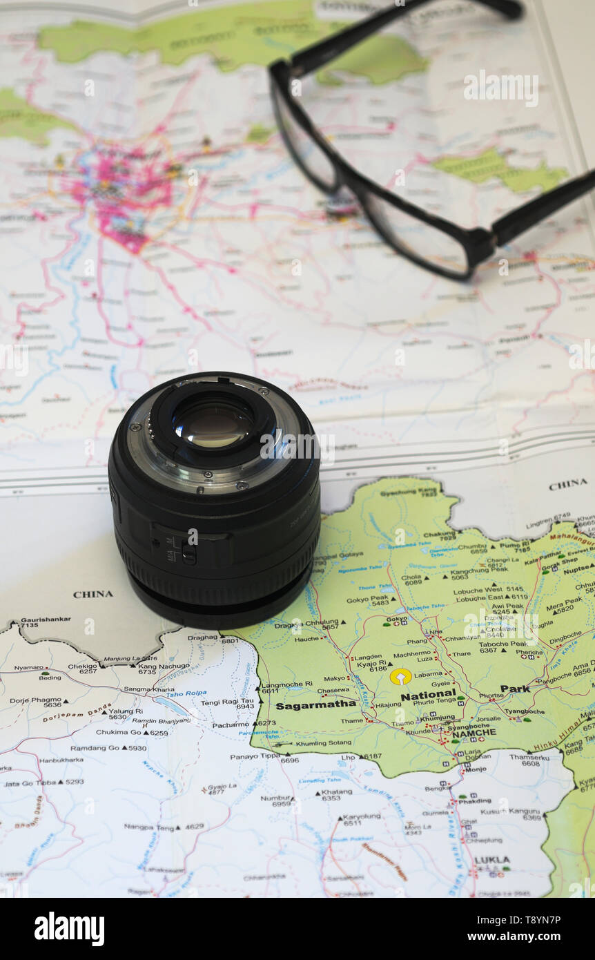 top view of camera lens and eyeglasses on a map of Nepal Stock Photo ...