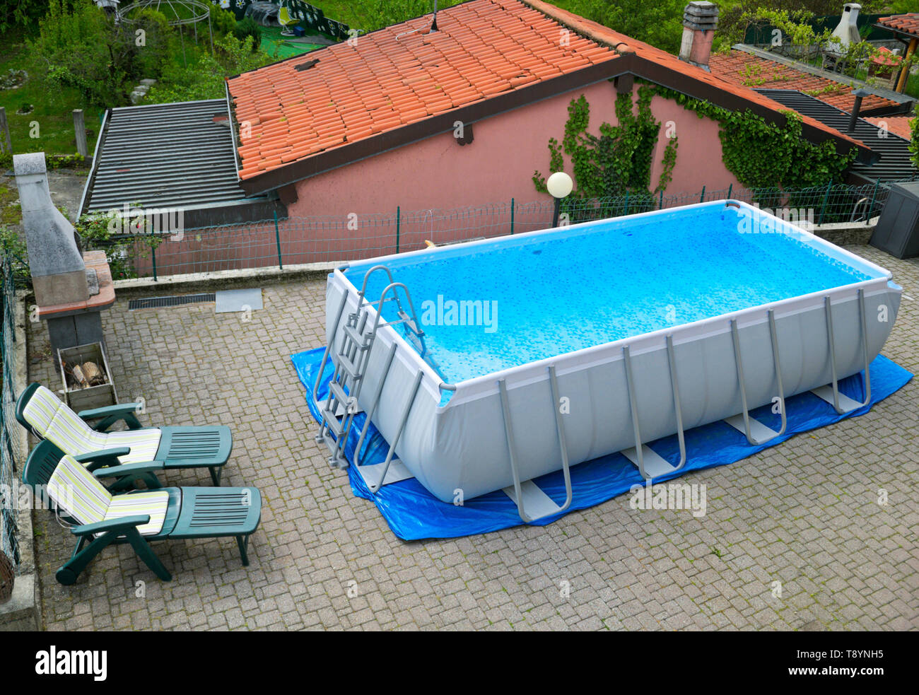assembled swimming pool in backyard Stock Photo - Alamy