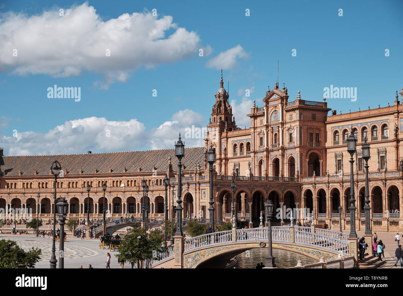view of Seville's main square Plaza de Espana from arch covered walkway ...
