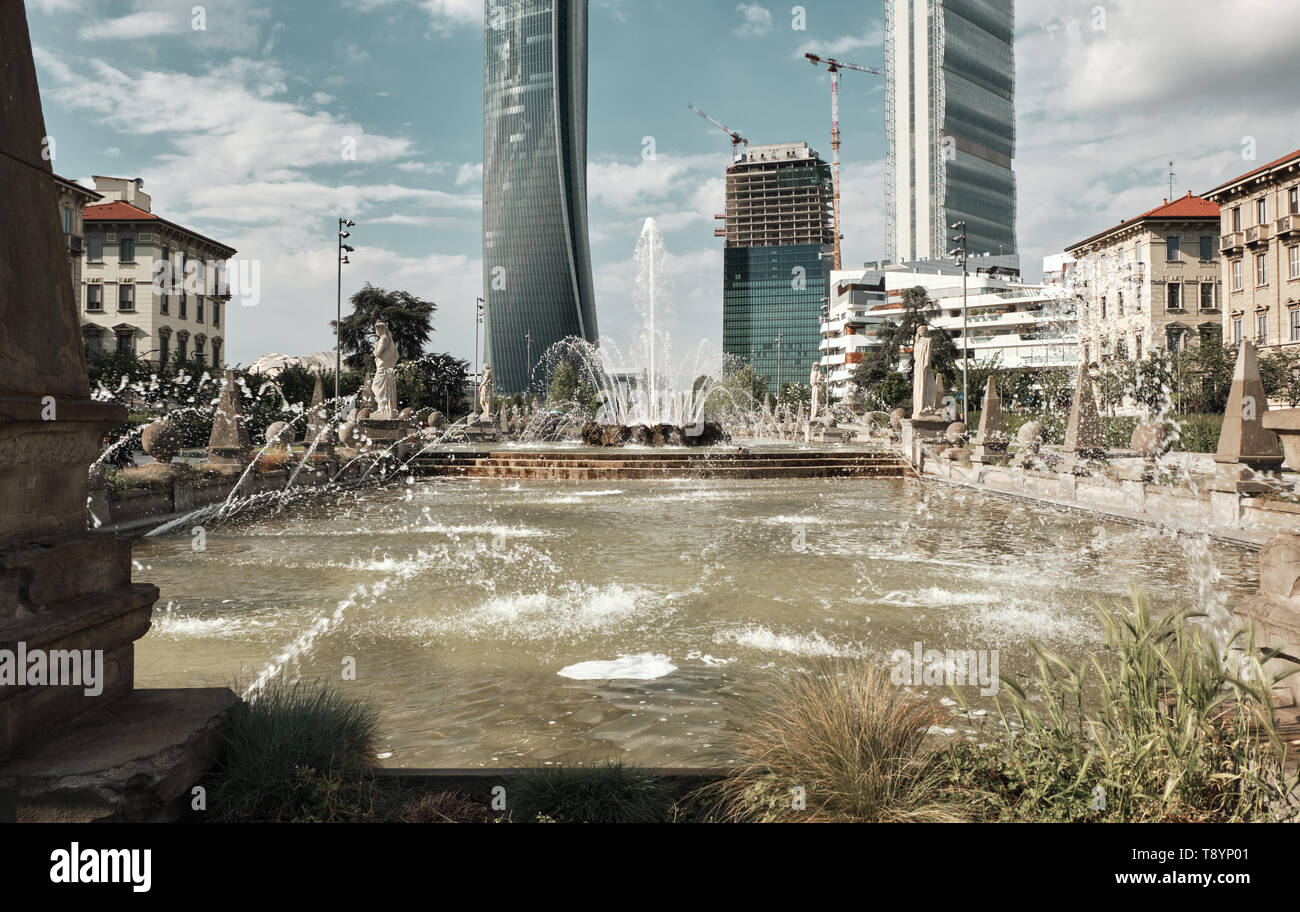 view through fountain of Square "Tre Torri" (Three towers), Milan ...