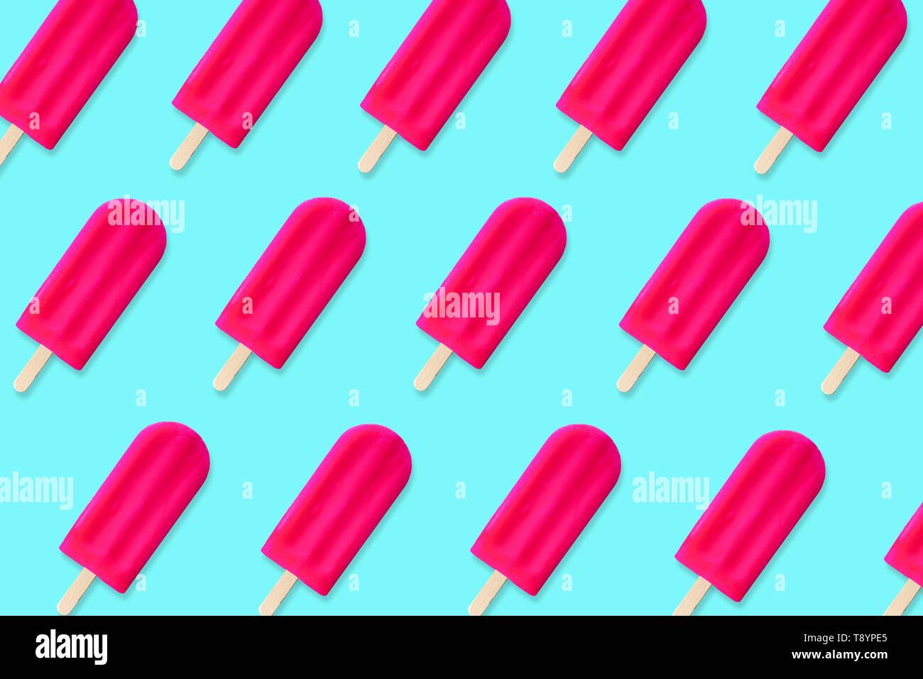 Colorful summer pattern. Bold pink popsicles on a pastel blue ...