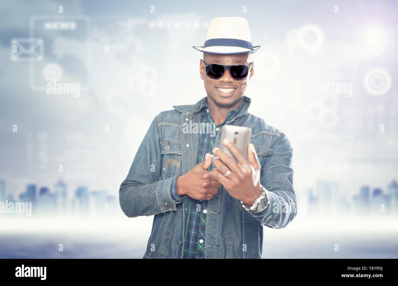 Young american african guy with cell phone. Handsome man. Device ...