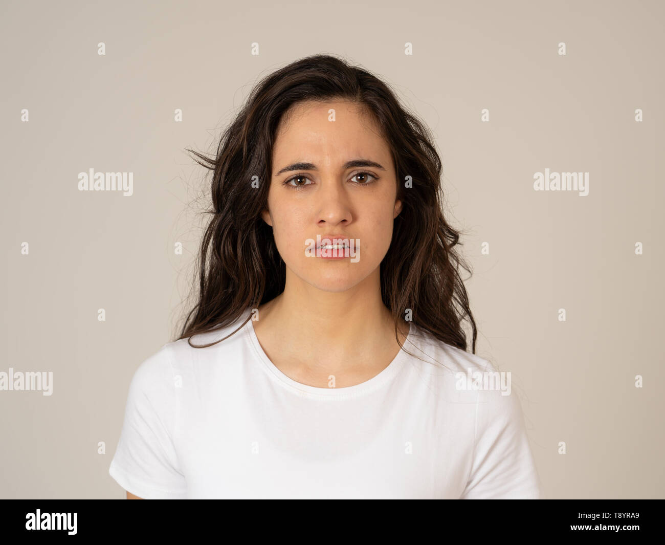 Close up of young attractive frustrated latin woman in stress with ...