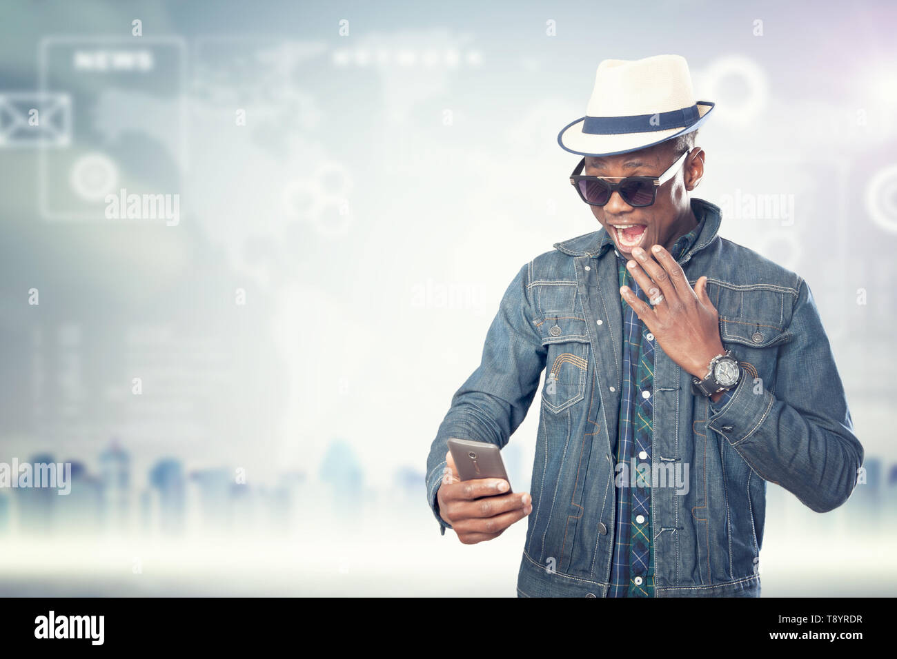 Young american african guy with cell phone. Handsome man. Device ...