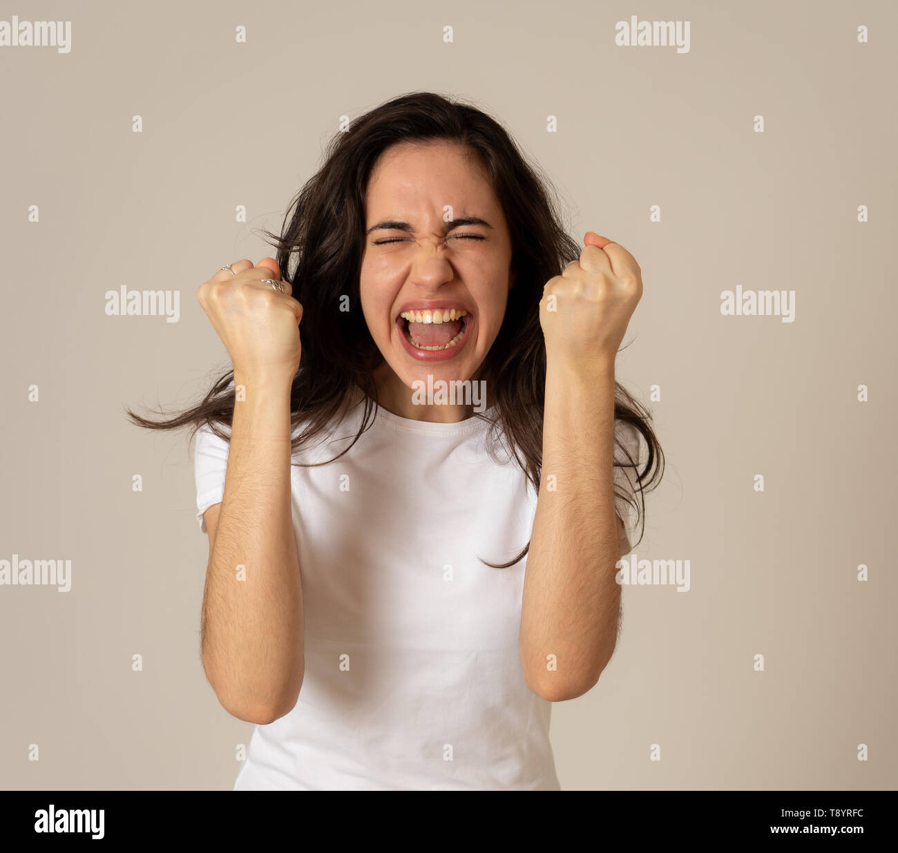 Young attractive latin woman celebrating success winning or feeling ...