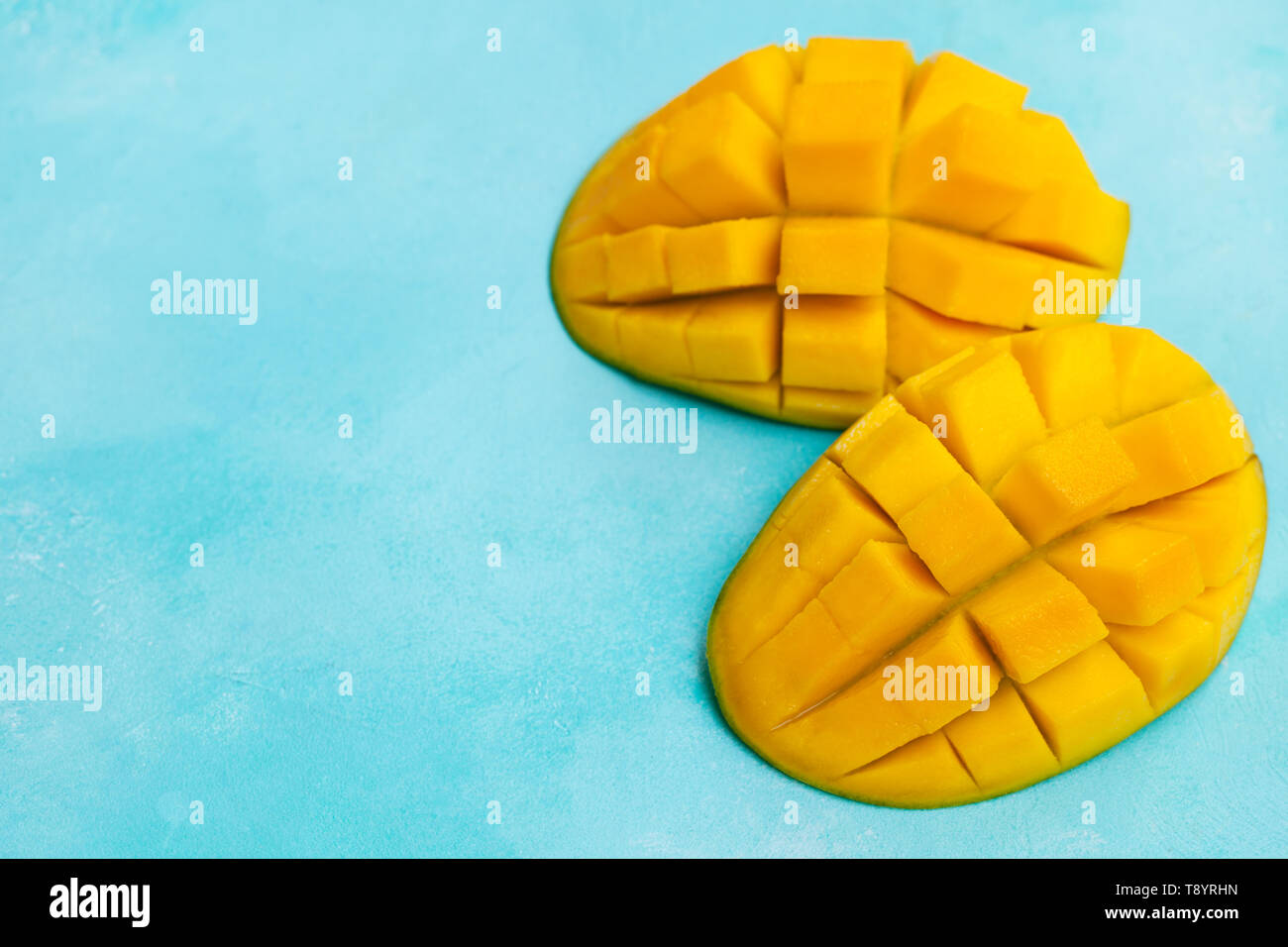 Fresh mango organic product. Blue background. Top view. Copy space ...