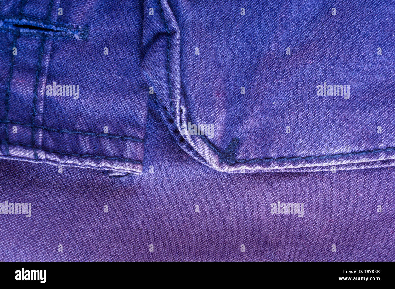 clothing items washed cotton fabric texture with seams, macro, close-up ...