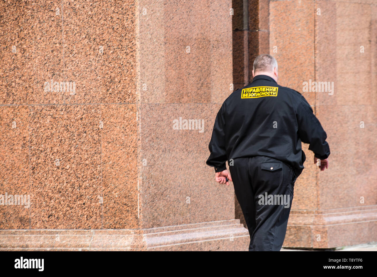 Security guard protection. Fat, heavily plump guard bypasses territory ...