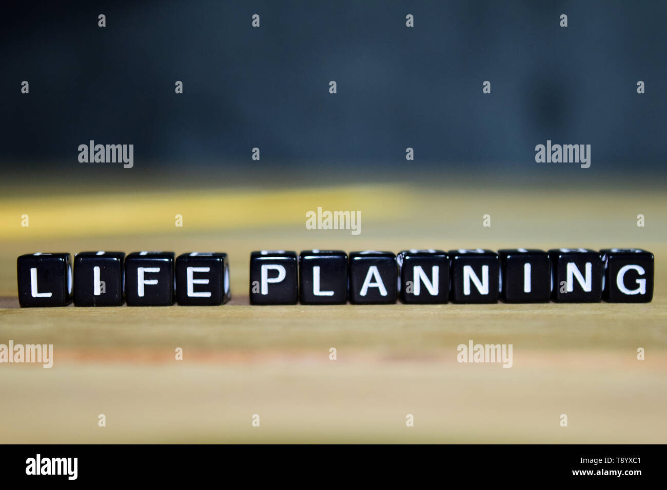 Life Planning concept wooden blocks on the table. With personal ...