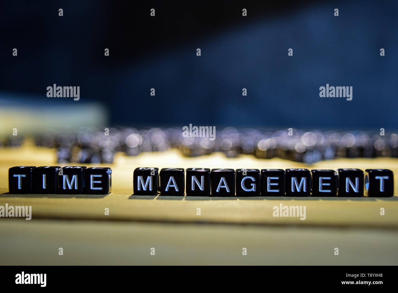 TIME MANAGEMENT concept wooden blocks on the table. With personal ...