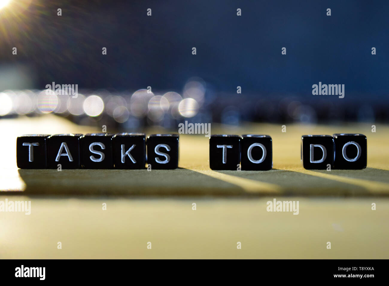 TASKS TO DO concept wooden blocks on the table. With personal ...