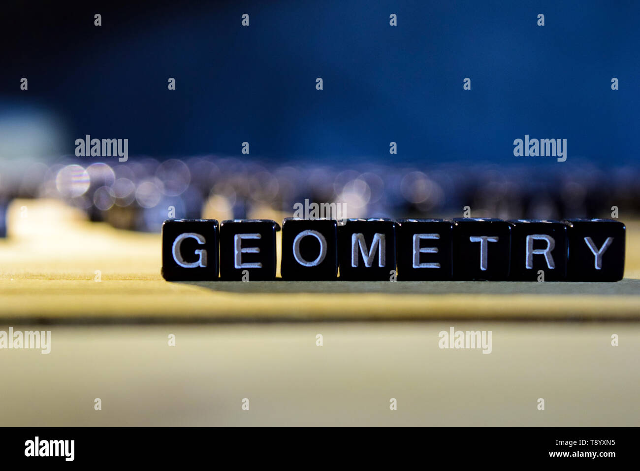 GEOMETRY concept wooden blocks on the table. With personal development ...