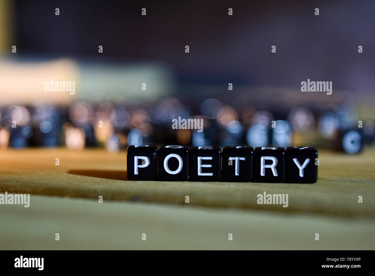 POETRY concept wooden blocks on the table. With personal development ...