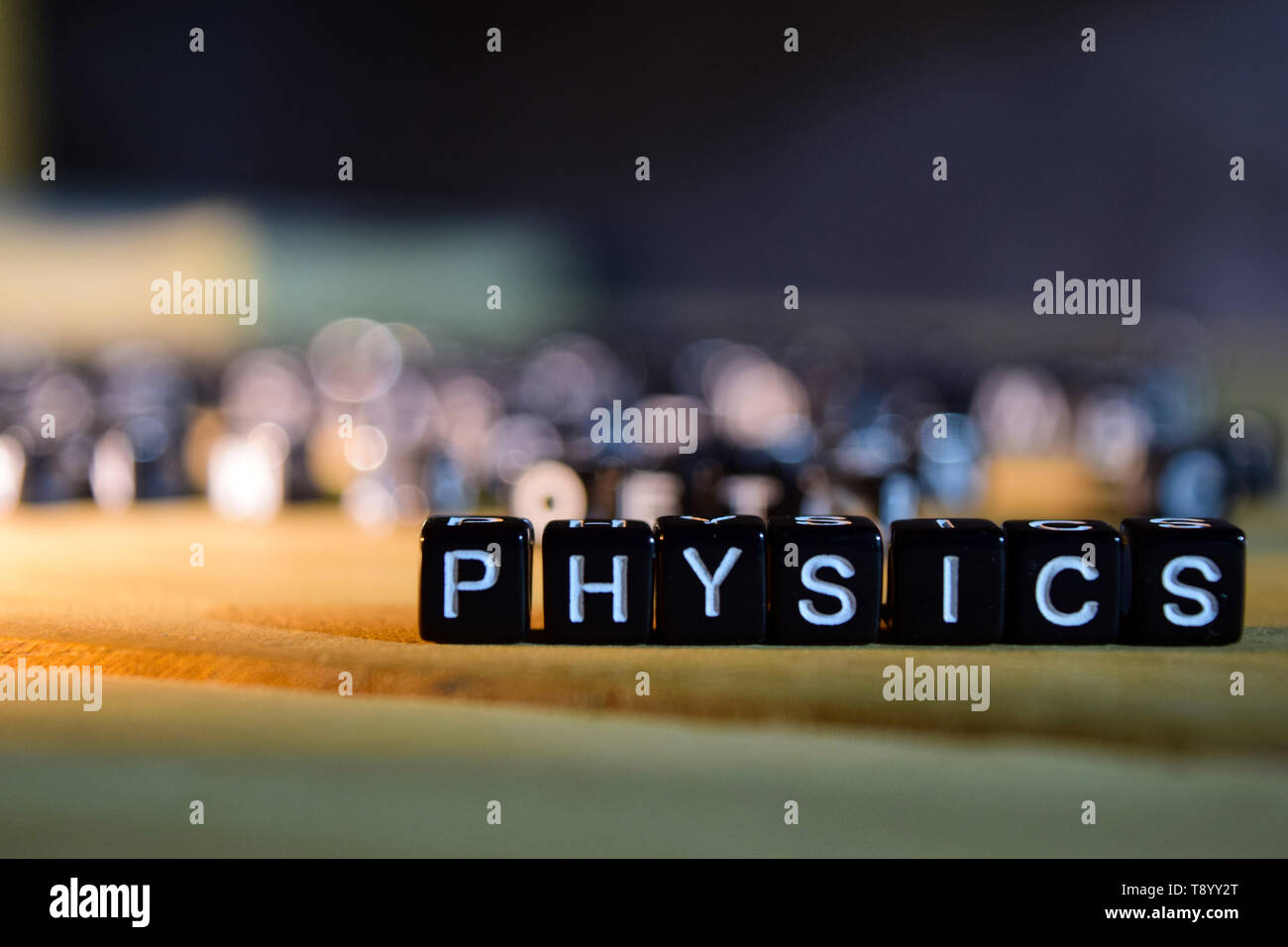 PHYSICS concept wooden blocks on the table. With personal development ...